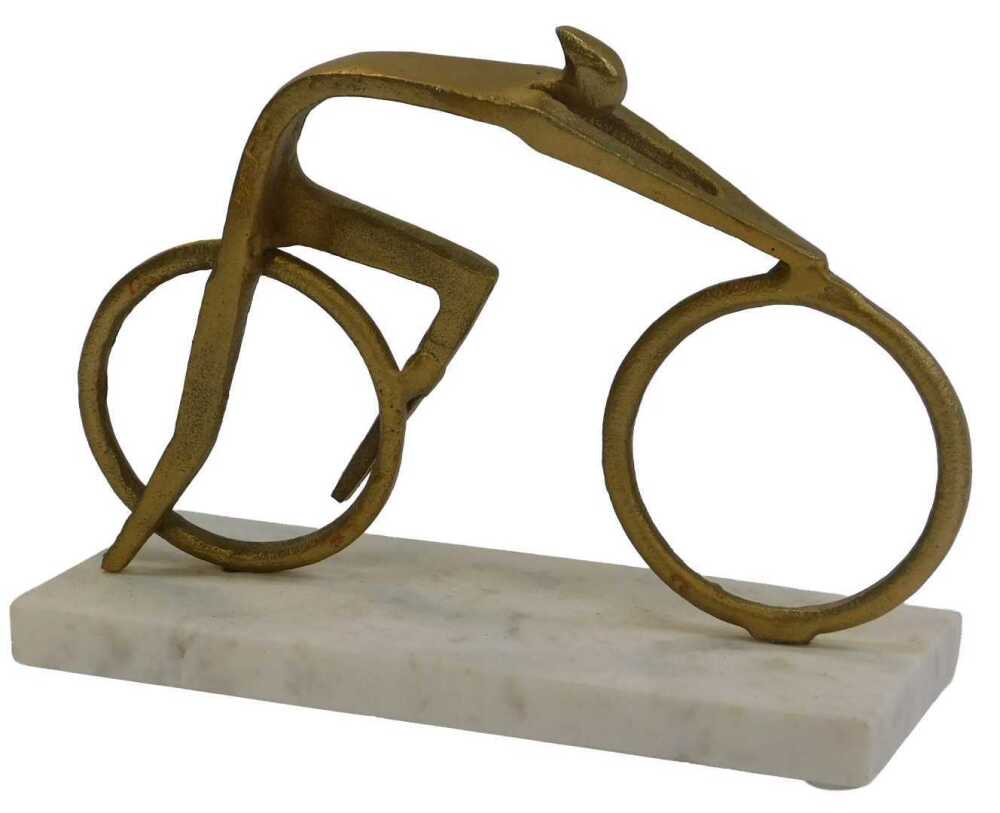 Cycling interest. A modernist gilt metal sculpture of a cyclist, on a ...