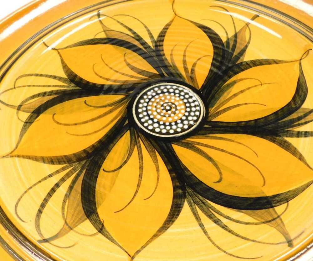 - A late 20thC Alvingham pottery charger, decorated with a stylised ...