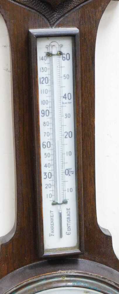 - A late 19thC oak cased barometer, with a circular white enamel dial ...