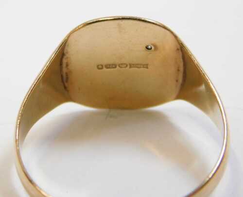 A 9ct gold signet ring, the rectangular ring head with rounded edges ...