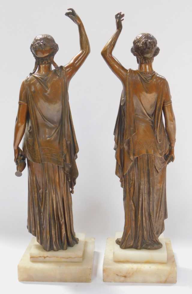 - A pair of late 19thC bronze figures of Roman ladies, modelled ...