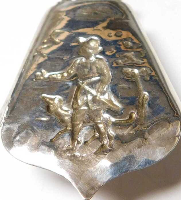 A pair of George III silver sugar tongs, with bright cut engraving ...