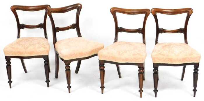 A set of eight late Regency rosewood bar back dining chairs, with ...